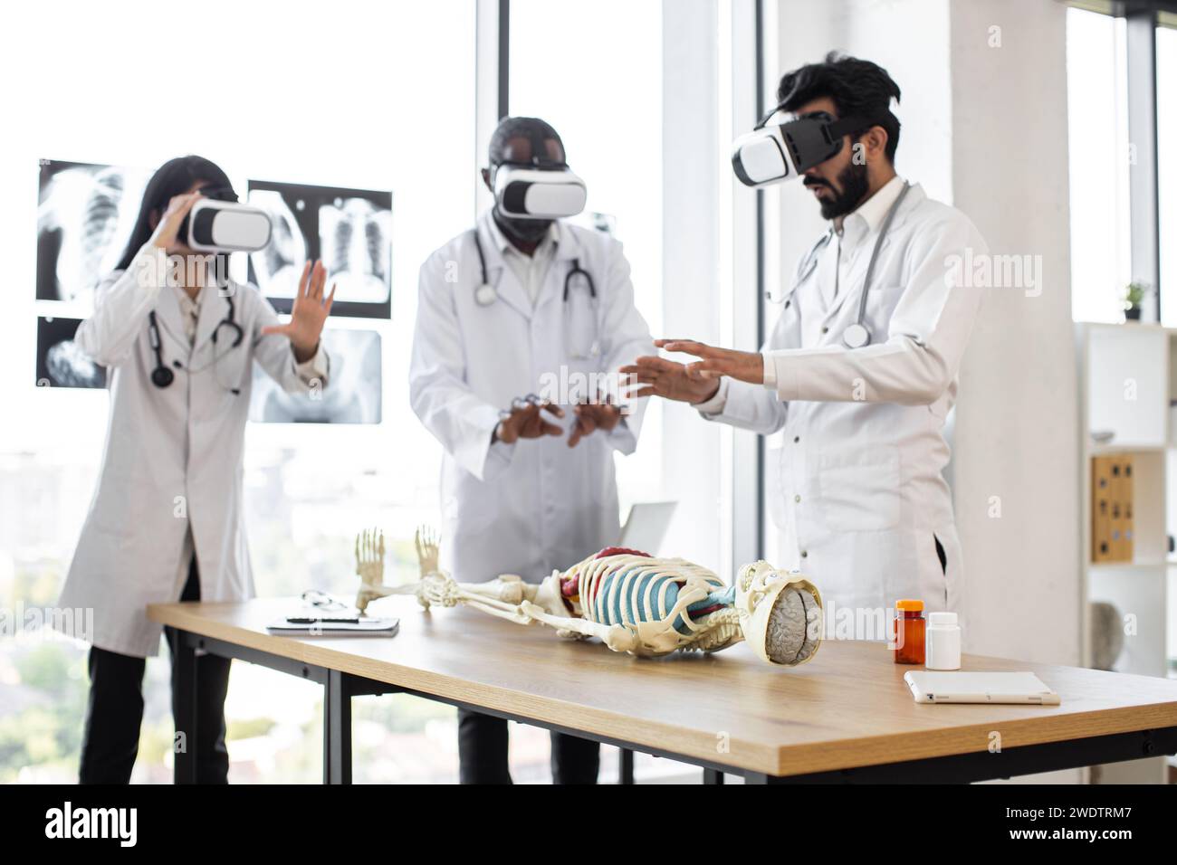 Young multiethnic doctors, bioengeneers, scientists with virtual ... Young multiethnic doctors, bioengeneers, scientists with virtual ...