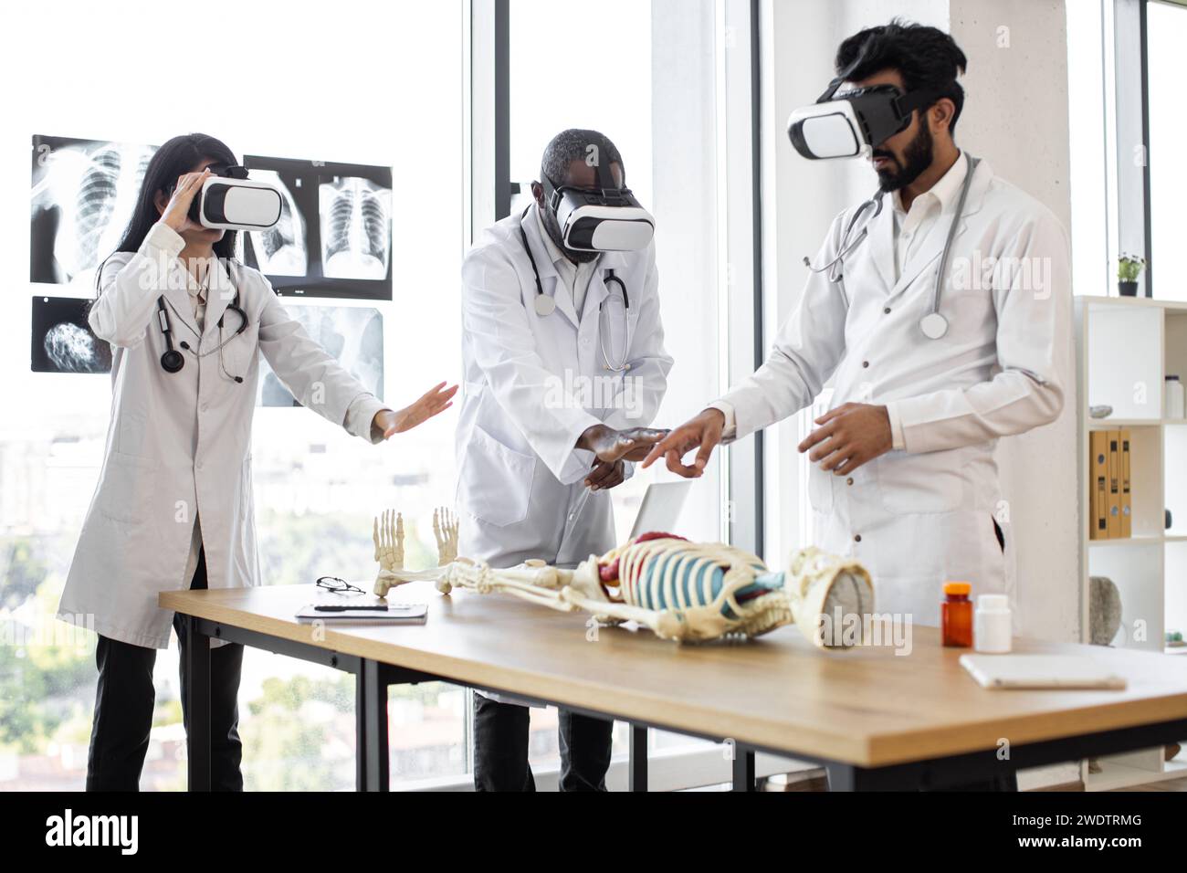 Young multiethnic doctors, bioengeneers, scientists with virtual ... Young multiethnic doctors, bioengeneers, scientists with virtual ...