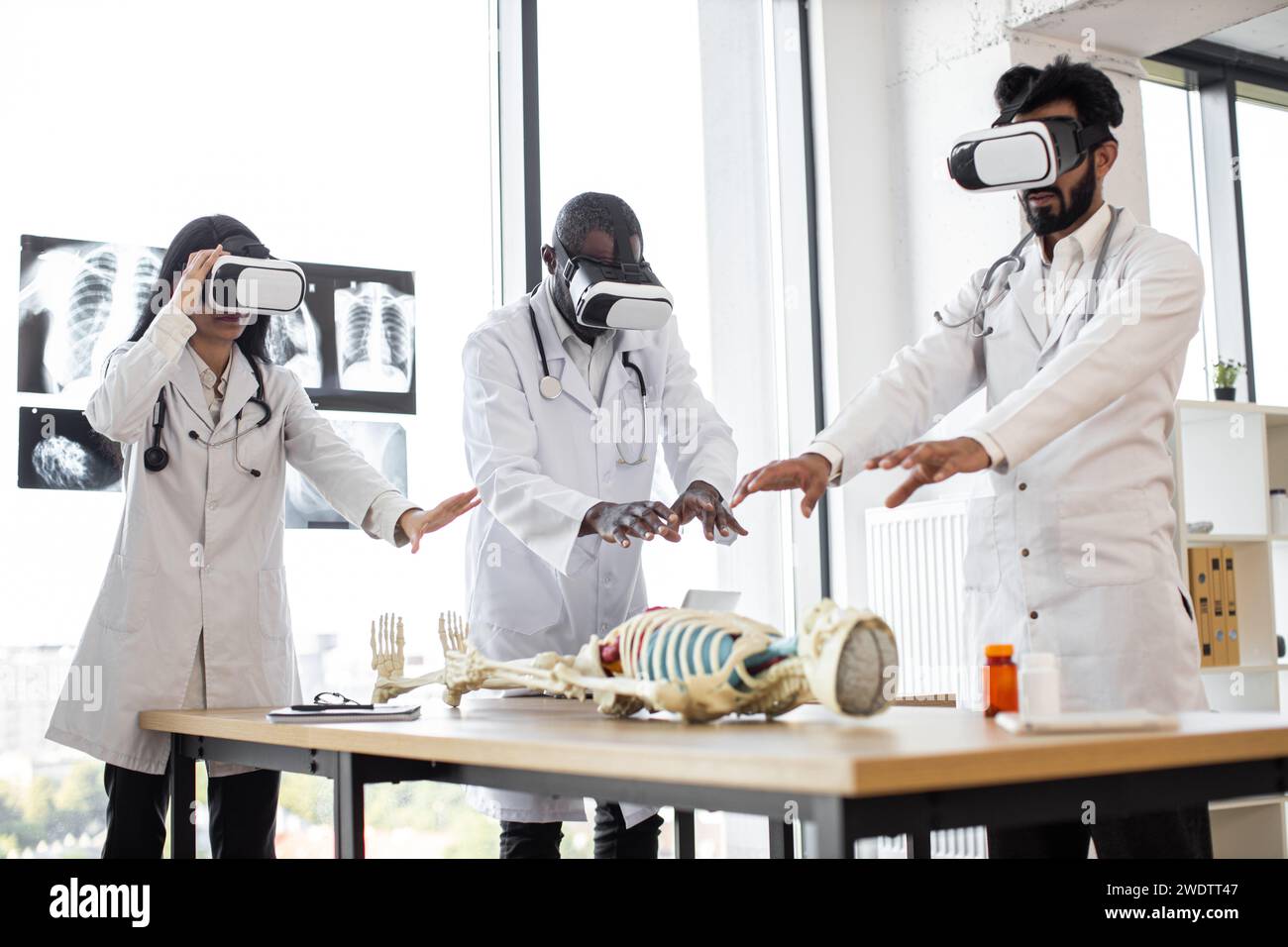Group of multiethnic scientists, doctors wearing virtual reality digital glasses Stock Photo - Alamy