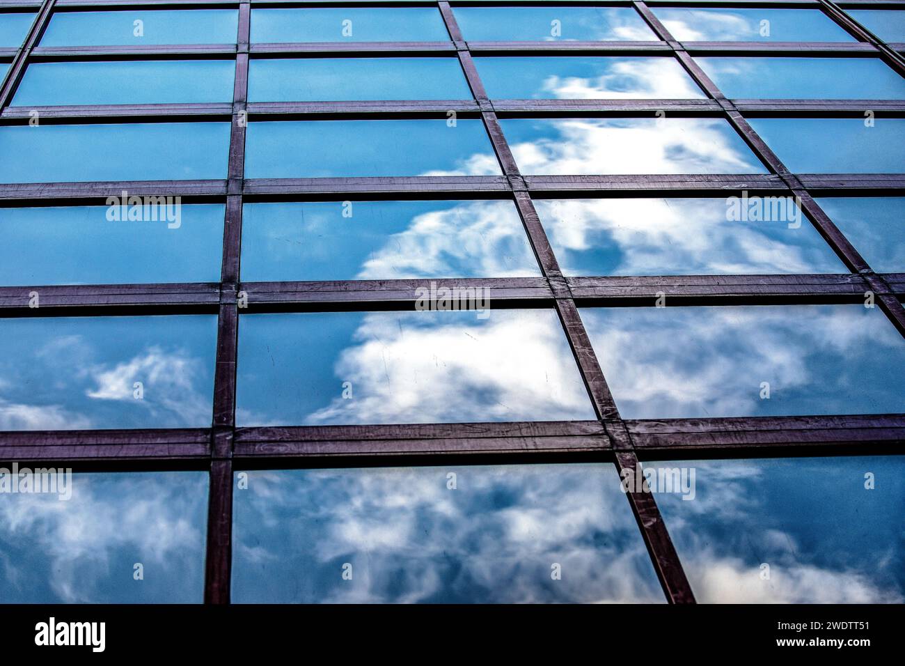 Reflections of clouds in windows Stock Photo - Alamy