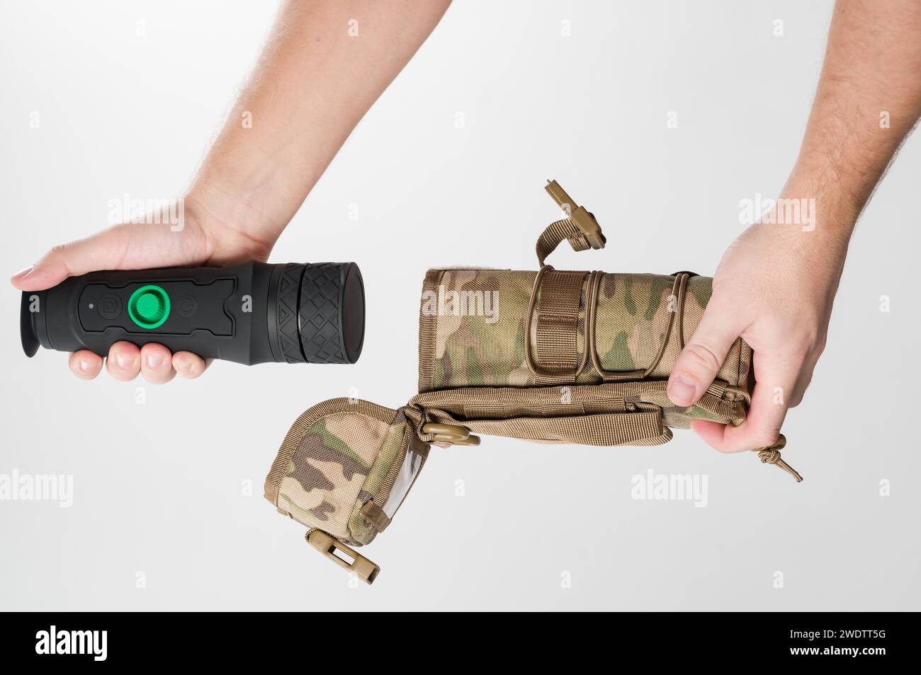 Military monocular in a case for storage and carrying, a man ...