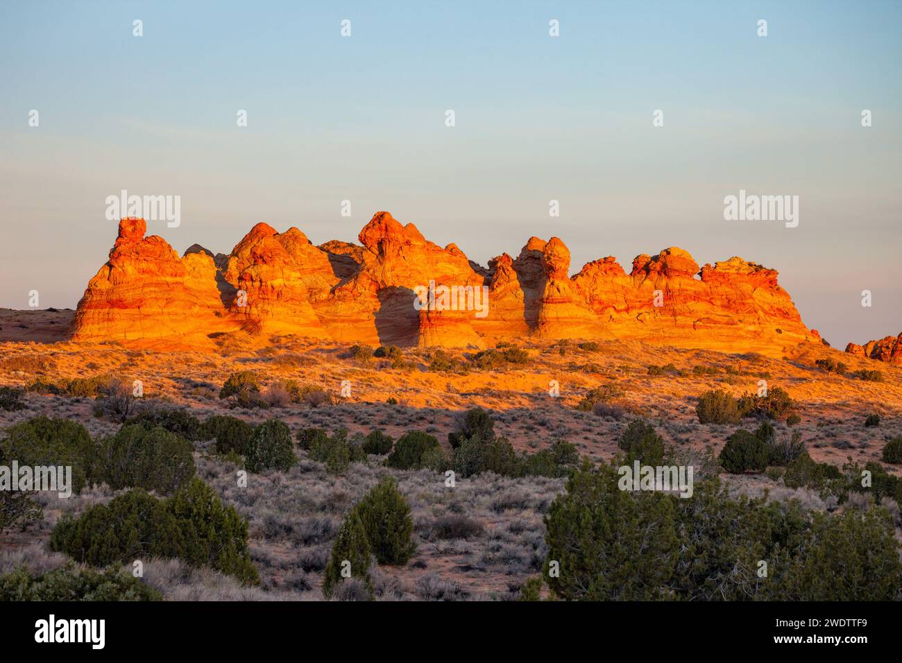 Sunrise light on eroded Navajo sandstone formations in South Coyote ...