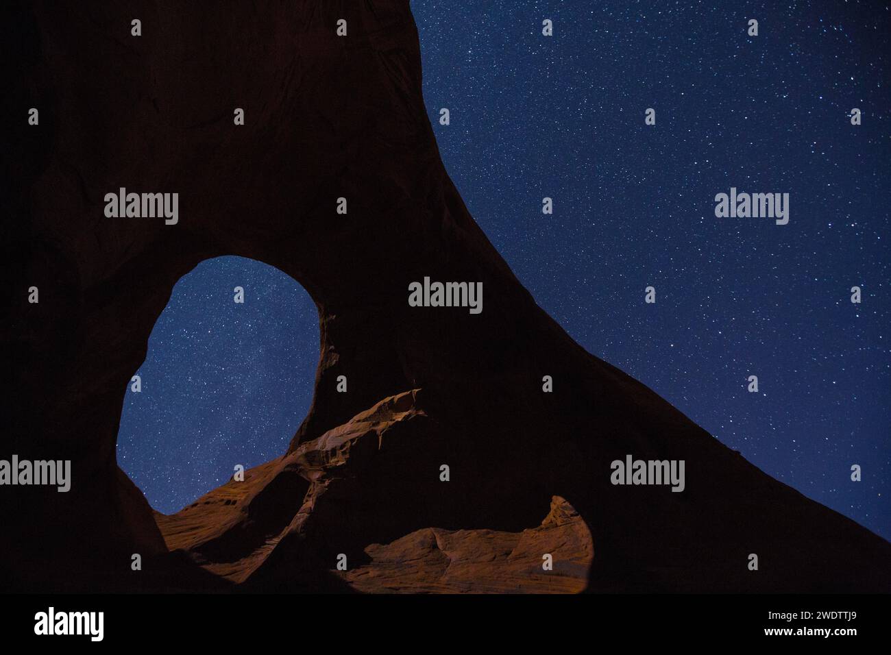 Stars & moon light through the Ear of the Wind Arch at night in the ...
