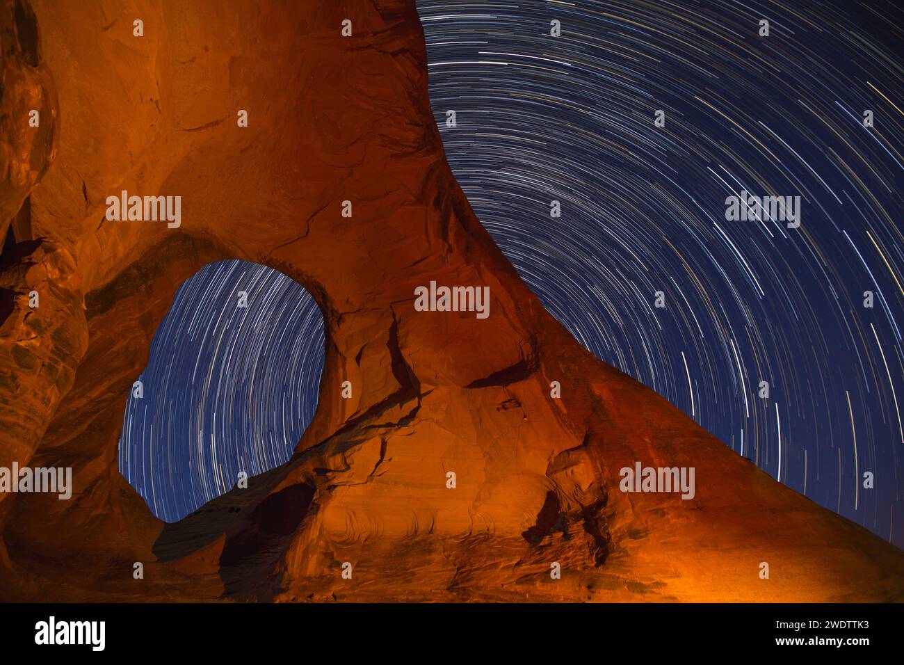 Star trails over the Ear of the Wind Arch at night in the Monument ...