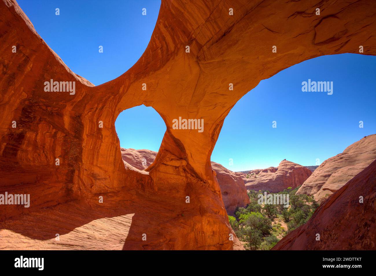 Spiderweb Arch, a large natural double arch in the Monument Valley ...