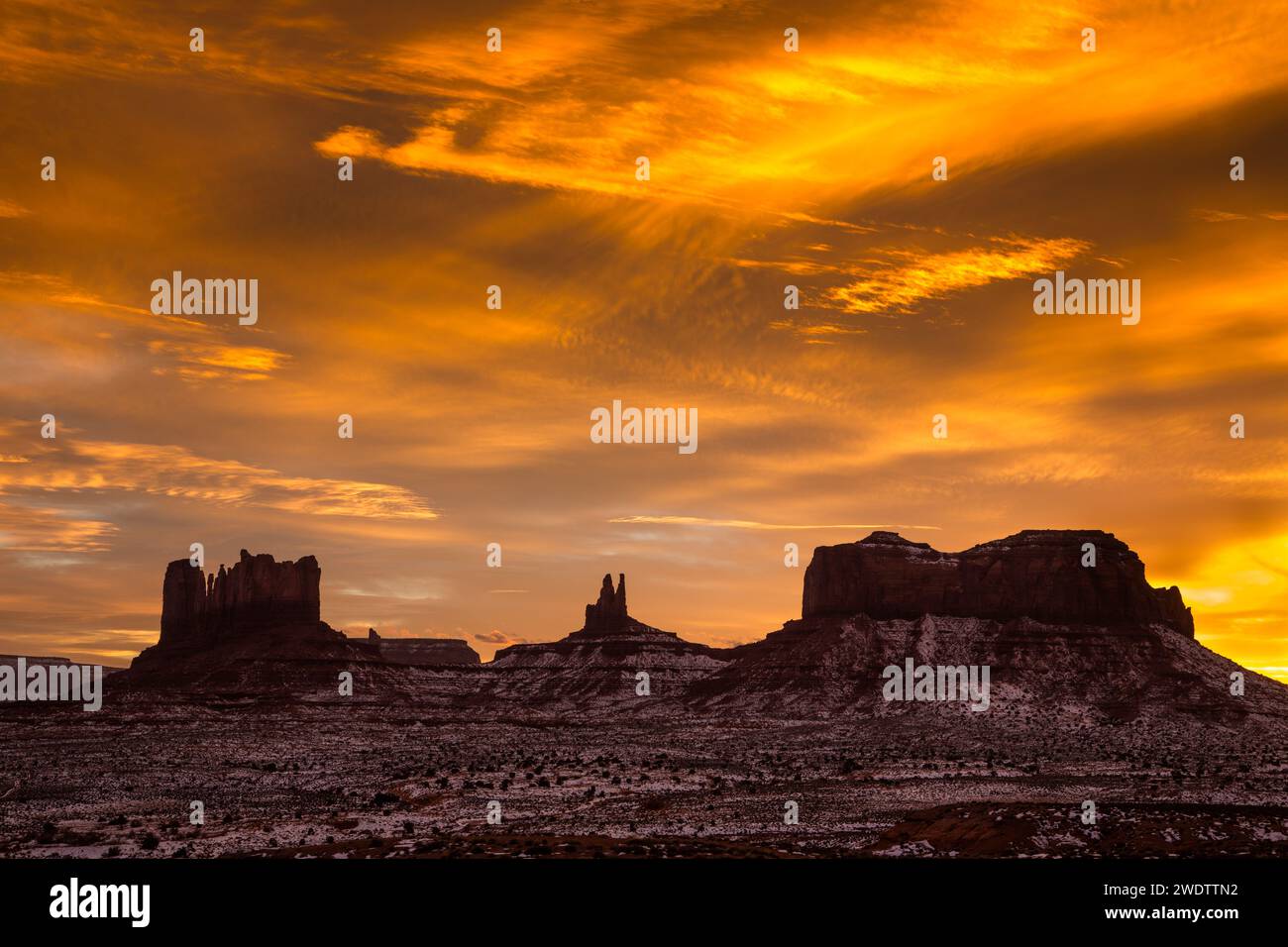 Colorful sunset skies over the Utah monuments in the Monument Valley ...