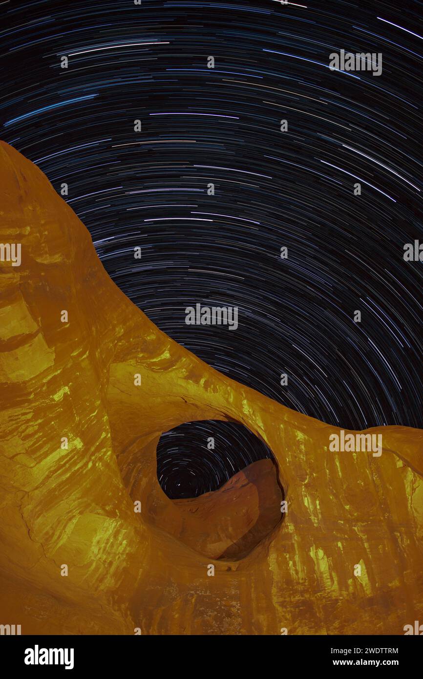 Star trails over Moccasin Arch at night in the Monument Valley Navajo ...