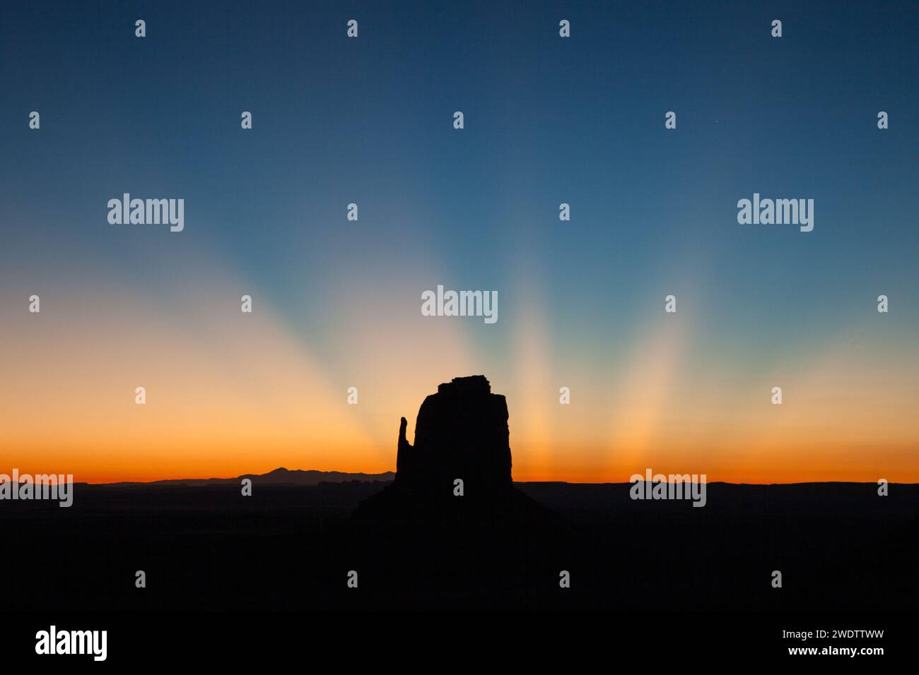 Crepuscular sun rays over the East Mitten before dawn in the Monument ...