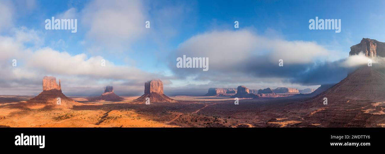 Low clouds over the Mittens and Merrick Butte in the Monument Valley ...