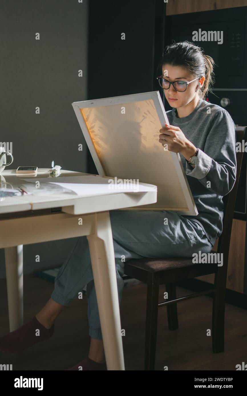 Painting a picture with a brush, self-isolation, home hobby Stock Photo ...