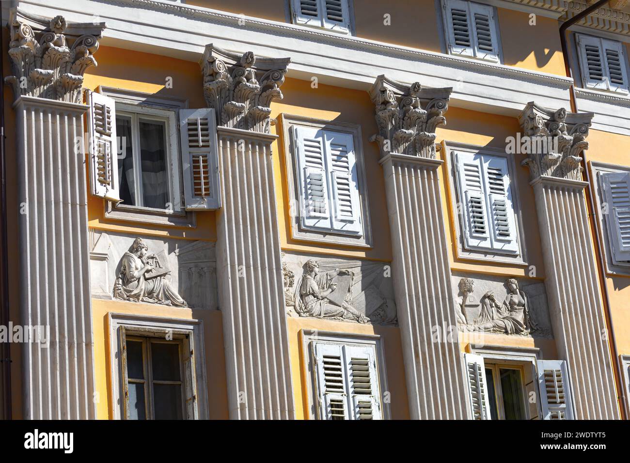 Facade of the Italian palace with details, featuring ornate stucco ...