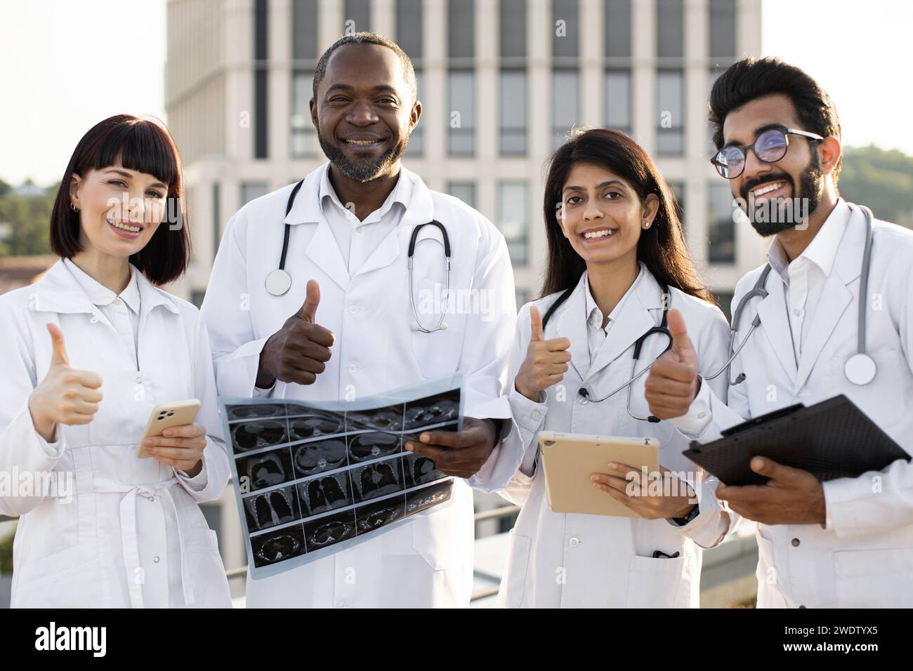 Thumbs up multiracial female doctor hi-res stock photography and images ...