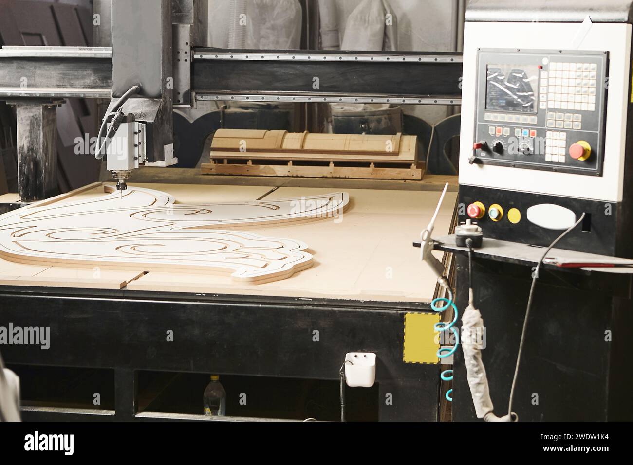 CNC milling machine. Machine tool in wood factory with drilling ...