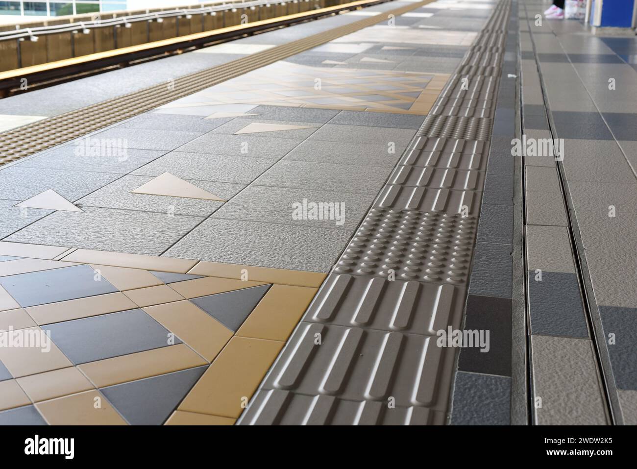 tactile paving for blind handicap on tiles pathway, walkway for ...
