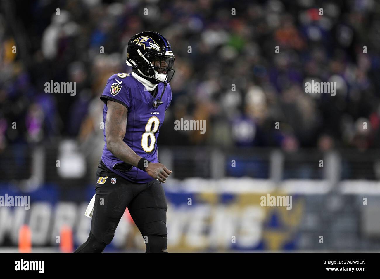 Baltimore Ravens quarterback Lamar Jackson (8) walks onto the field ...