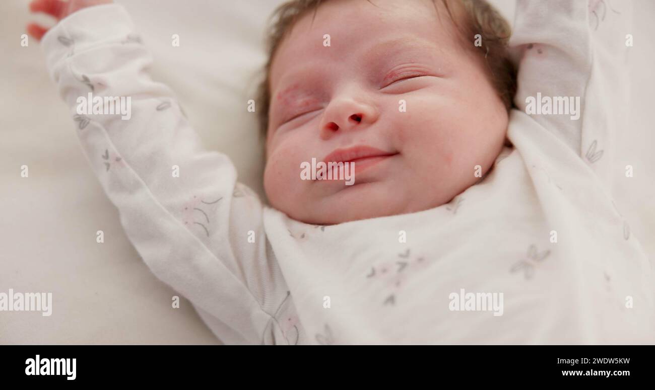 Baby, sleeping stretch and nursery bed with morning, nap and dreaming ...