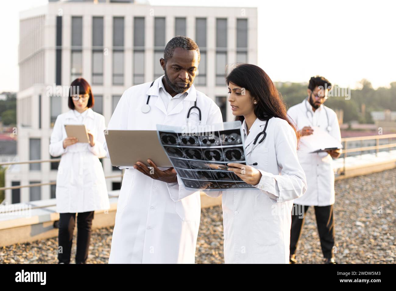 International group of health care workers at city rooftop Stock Photo ...