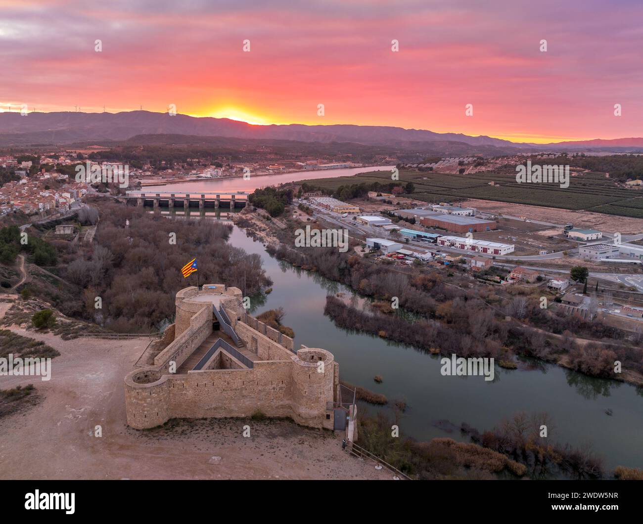 Aerial colorful sky sunset panoramic view of Flix new castle above the ...