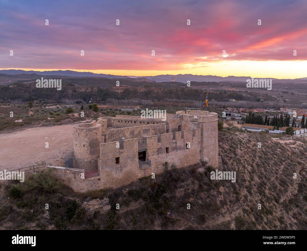 Aerial colorful sky sunset panoramic view of Flix new castle above the ...