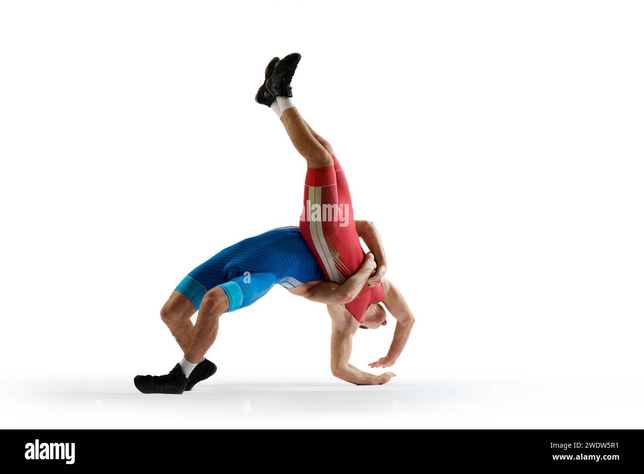 Two young men in blue and red wrestling tights wrestling and making ...