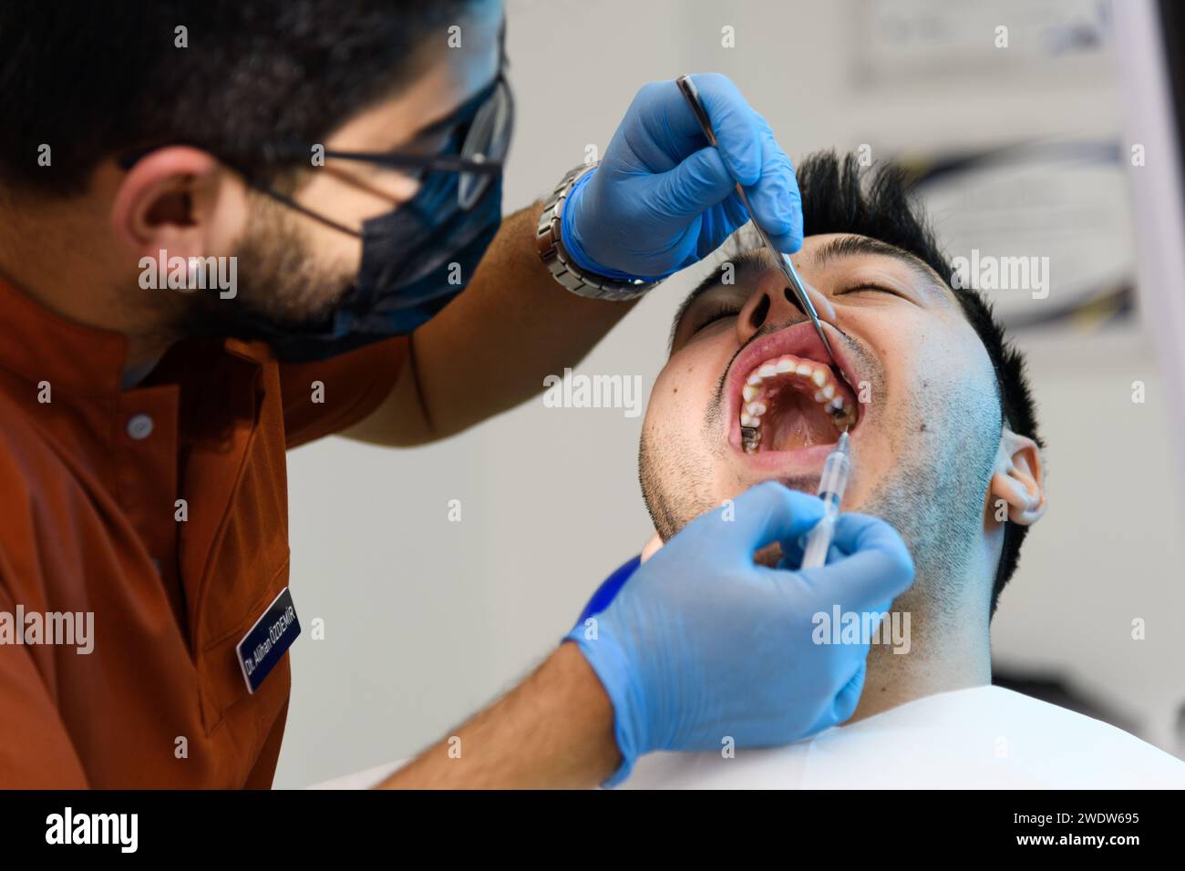 Expert dental whitening procedure in progress Stock Photo - Alamy