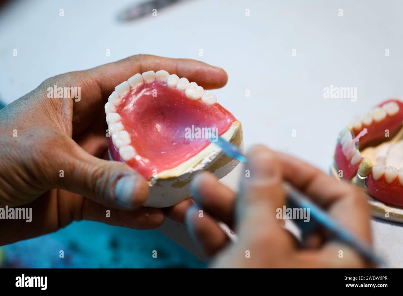 Close up of prosthetic dental craftsmanship, showcasing the detailed ...