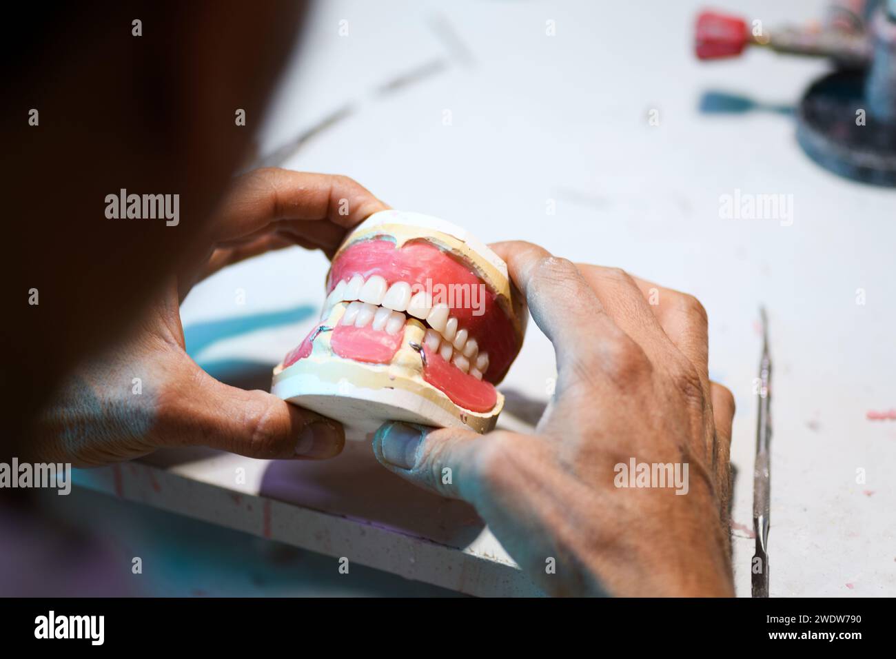Close up of prosthetic dental craftsmanship, showcasing the detailed ...