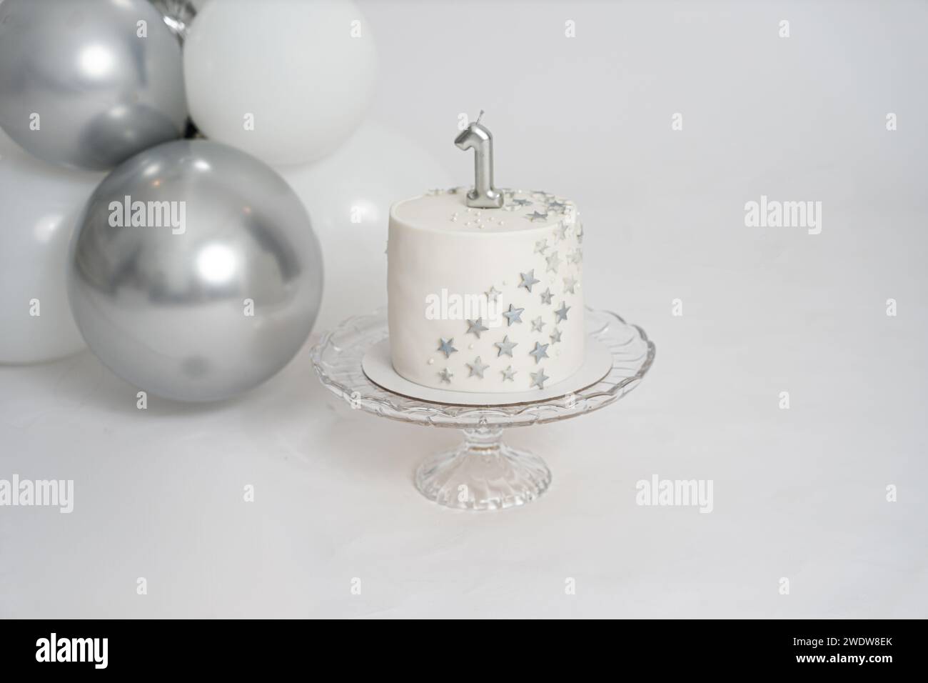 First Birthday cake white and silver 1st birthday cake with copy space ...