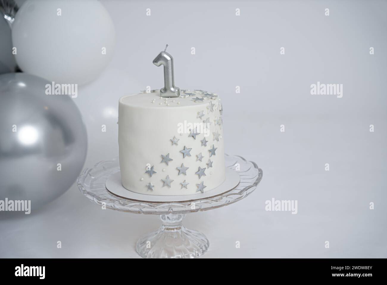 First Birthday cake white and silver 1st birthday cake with copy space ...