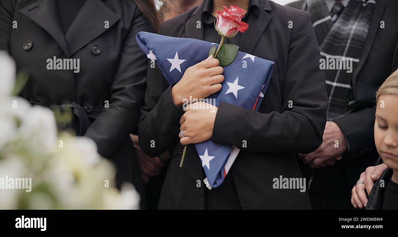 Funeral, graveyard and woman with American flag for veteran for respect ...