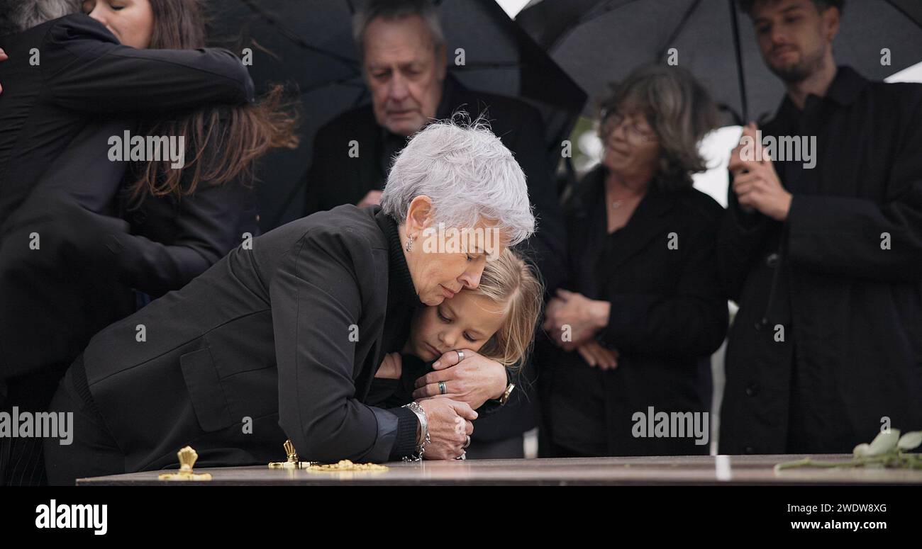 Funeral, crying family and child hug grandmother for support, mourning ...