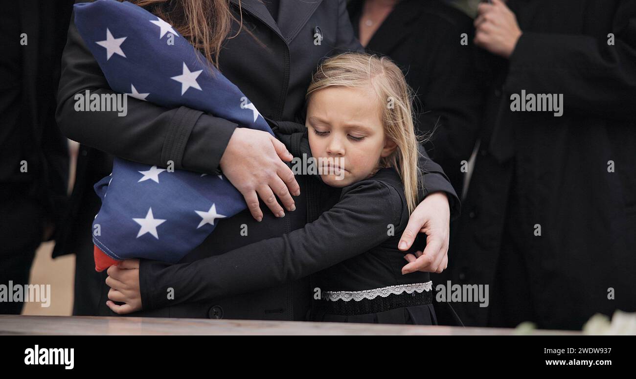 Sad, hug and a child at a funeral or graveyard for a ceremony or death ...