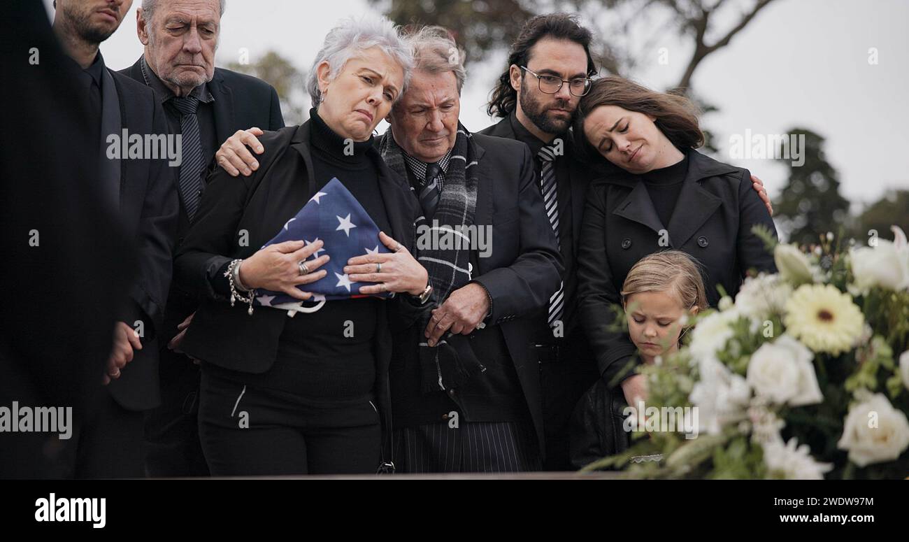 Funeral, cemetery and family with American flag for soldier for respect ...