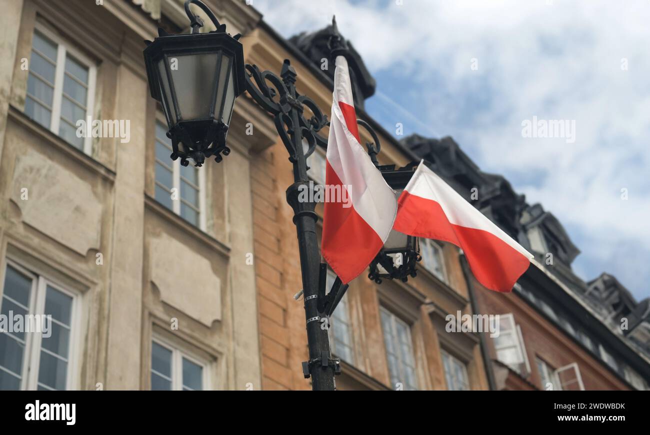 Polish flags in old town building exterior as symbol of patriotism and ...