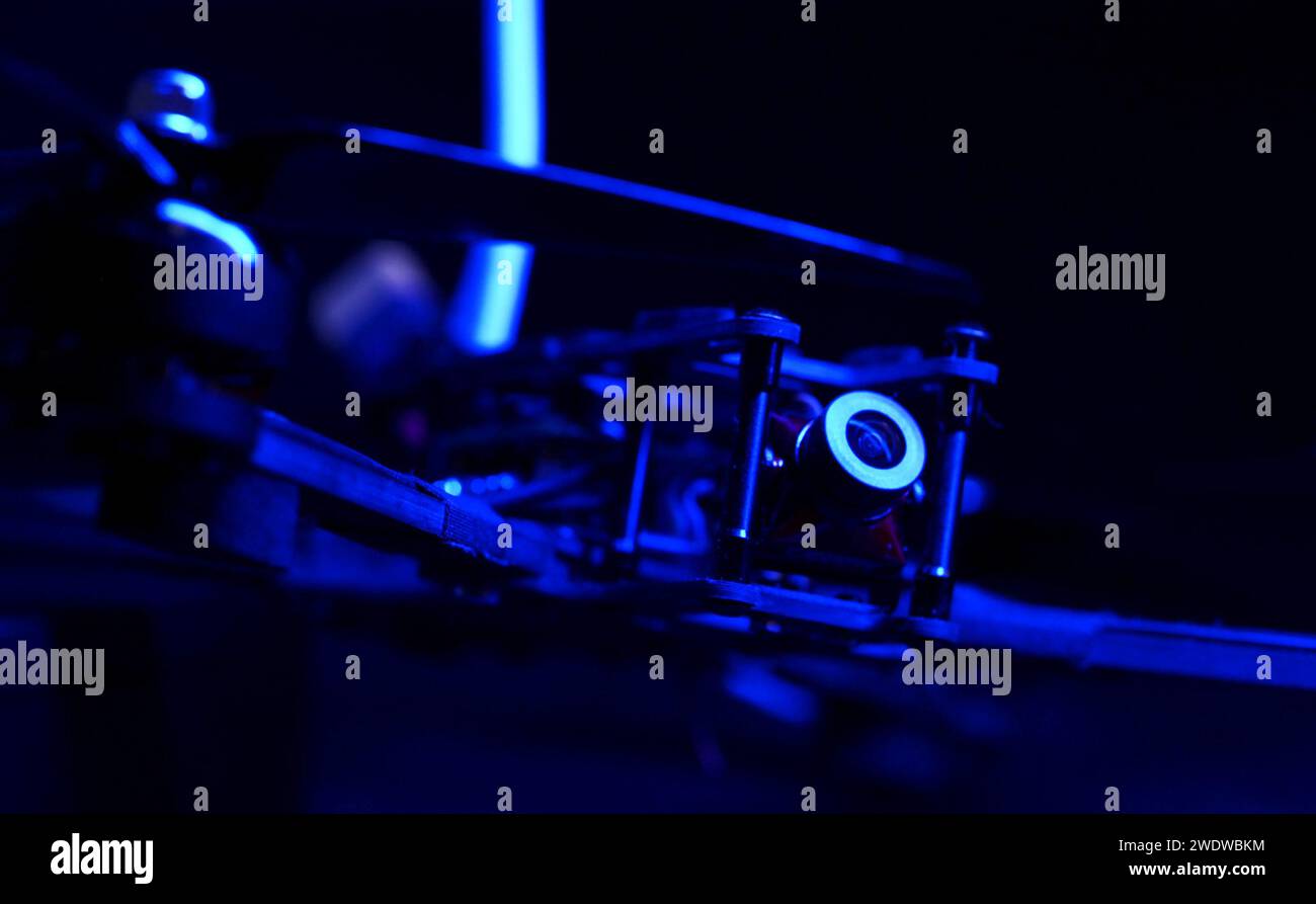 Cruise camera of fpv copter. Dron on a table in a colourful light Stock ...
