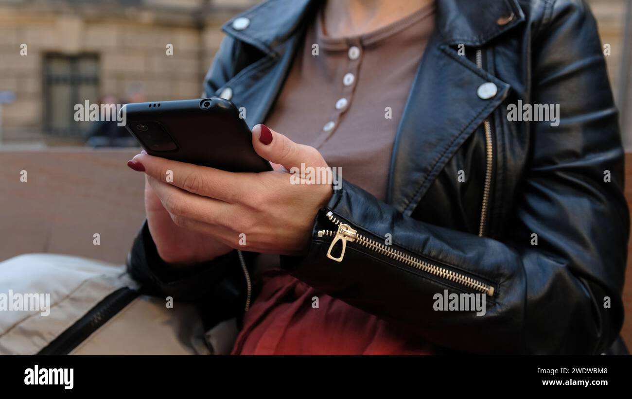 Attractive Woman Typing Message On City Street Showcases Concept Of ...