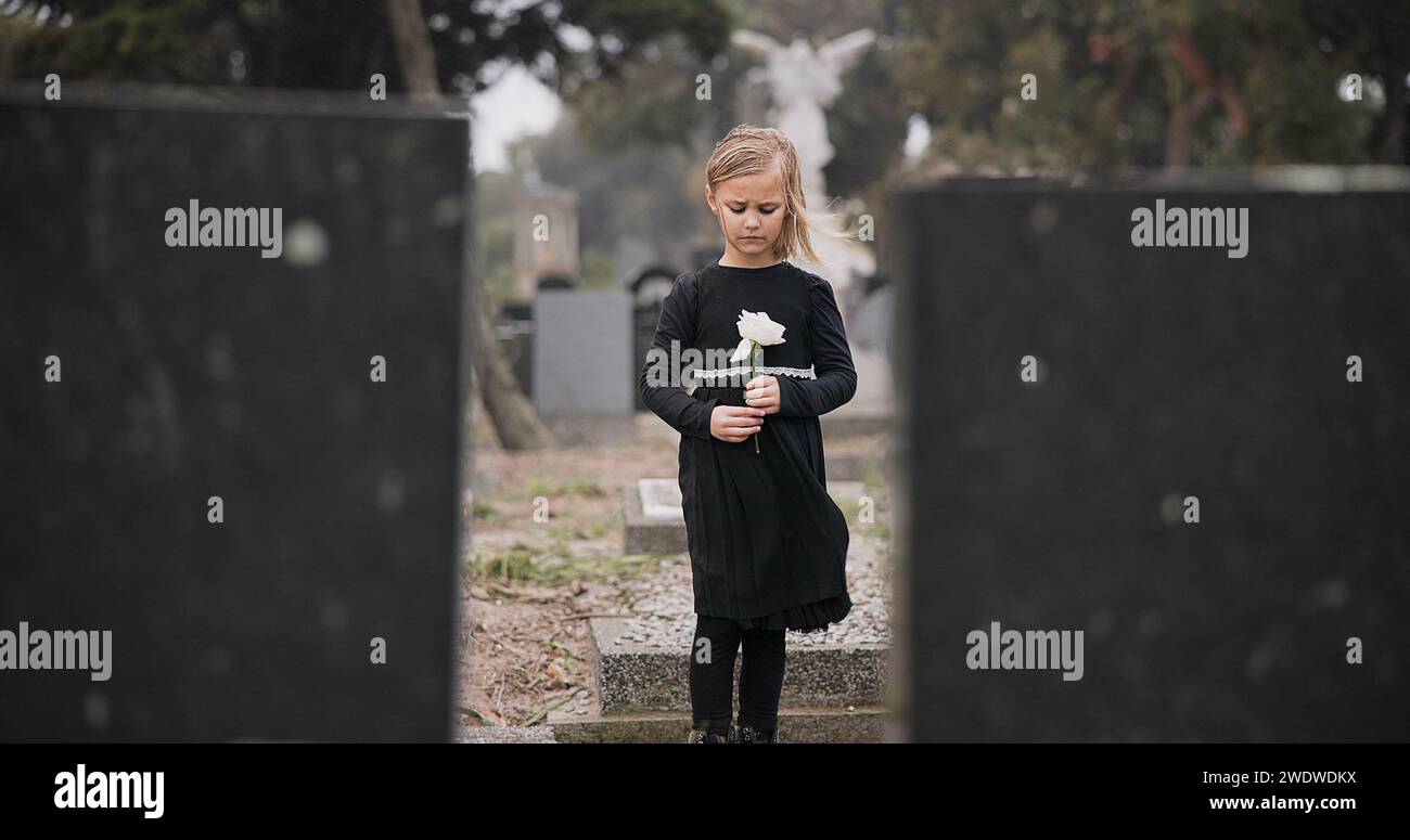 Sad, death or kid in cemetery for funeral. spiritual service or grave ...