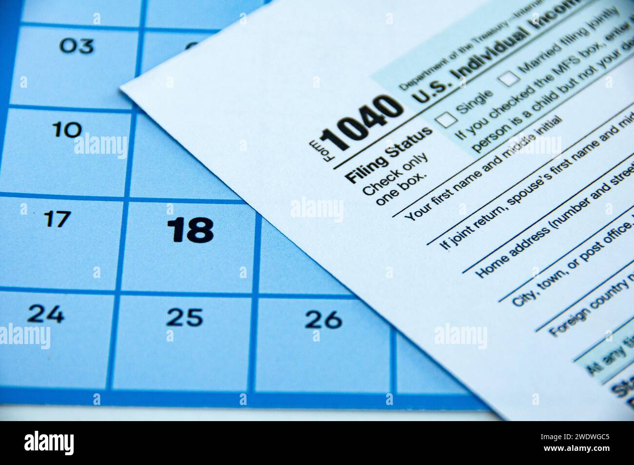 Tax form with calendar background. Tax season concept Stock Photo - Alamy