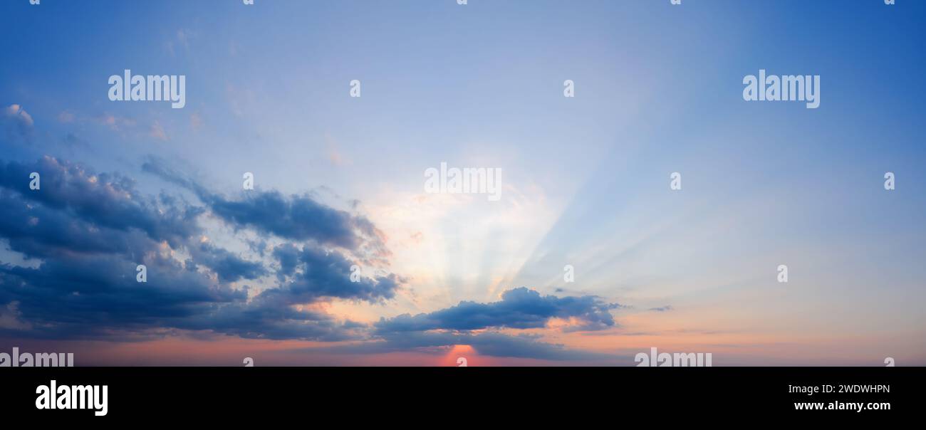 Beautiful dramatic sunset sky with rays of sun shining through the ...