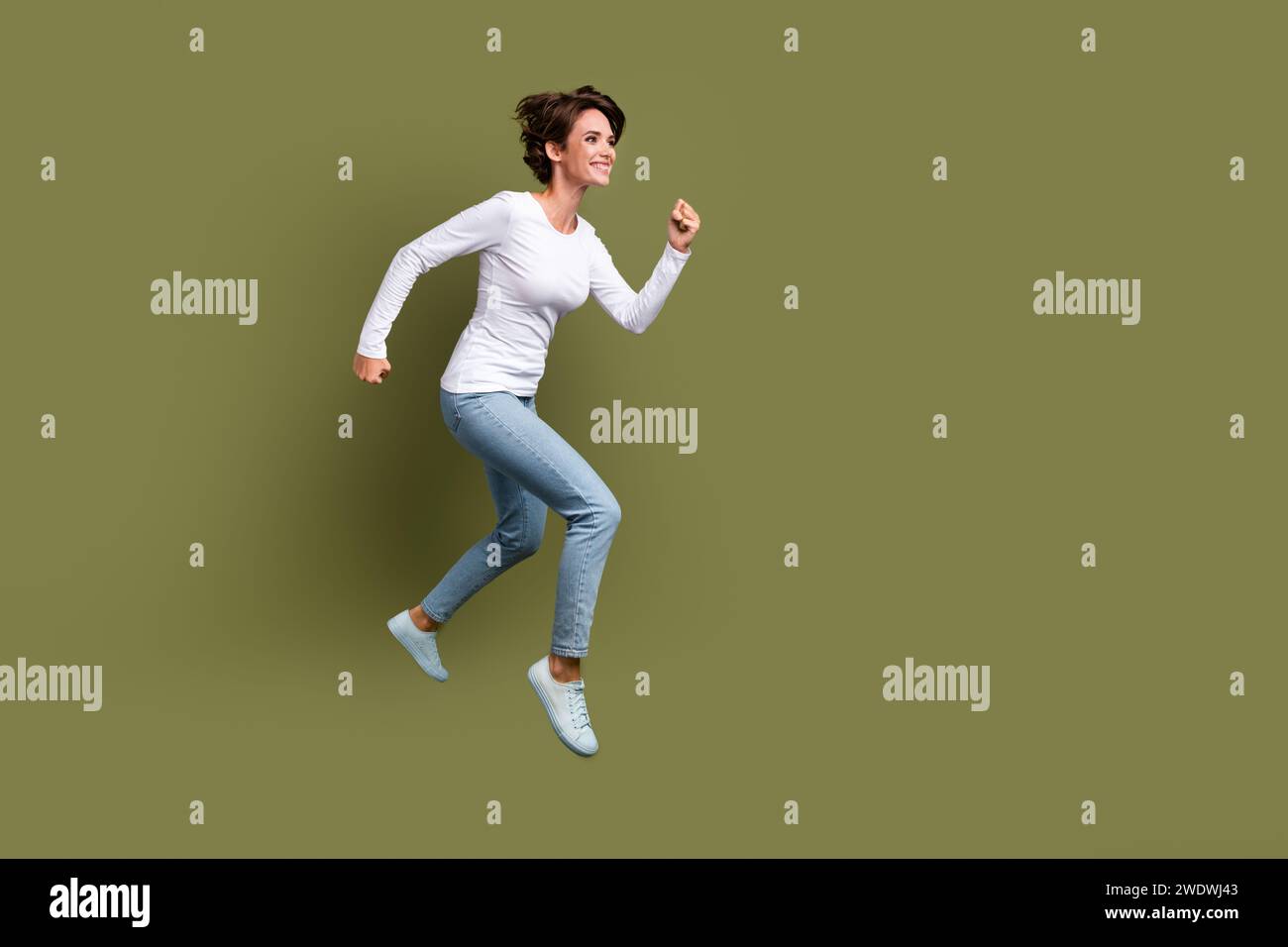 Full size photo of attractive young woman running fast shopping excited ...