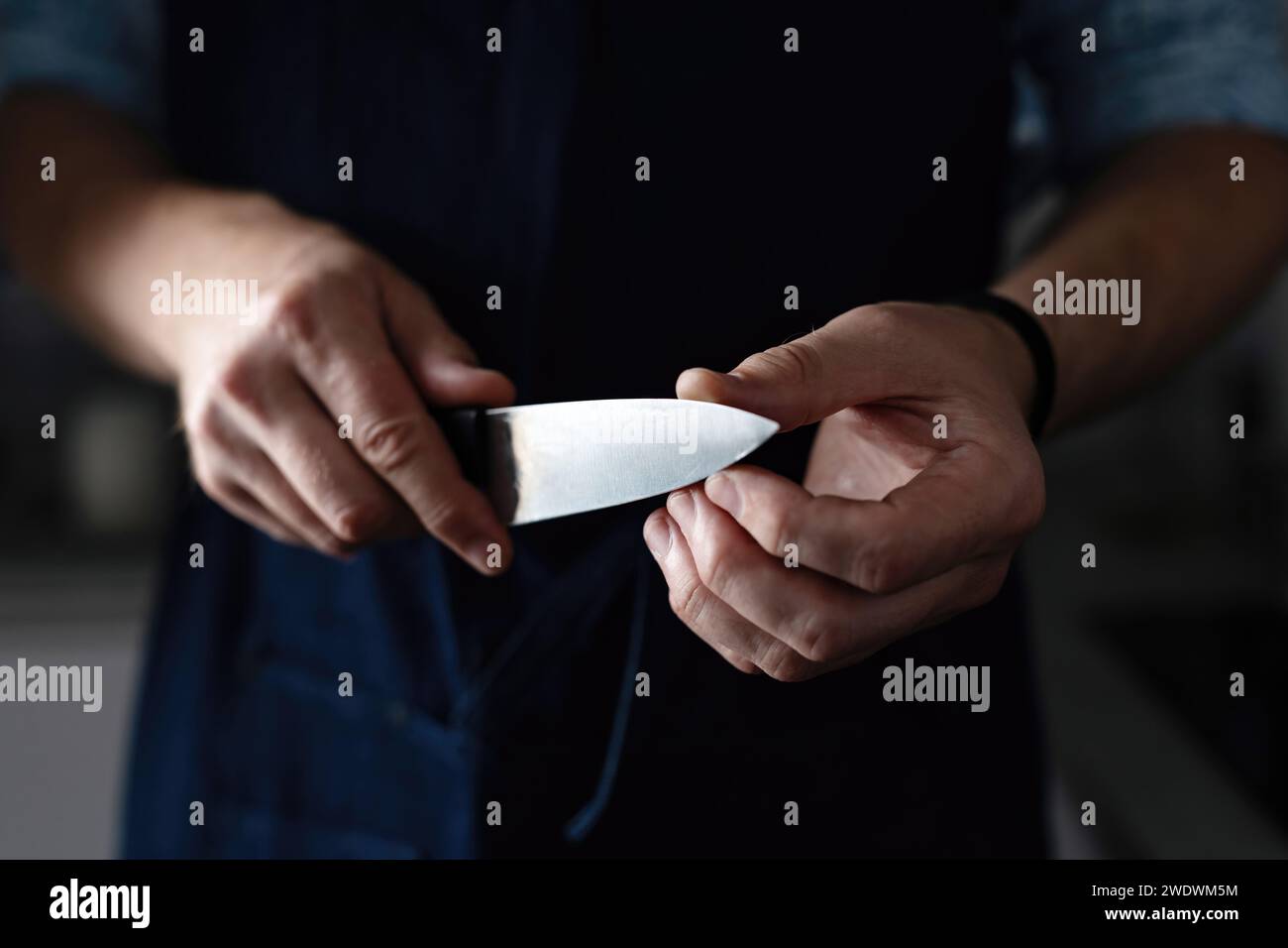 man's hands check kitchen knife, chief with sharpen knife Stock Photo ...