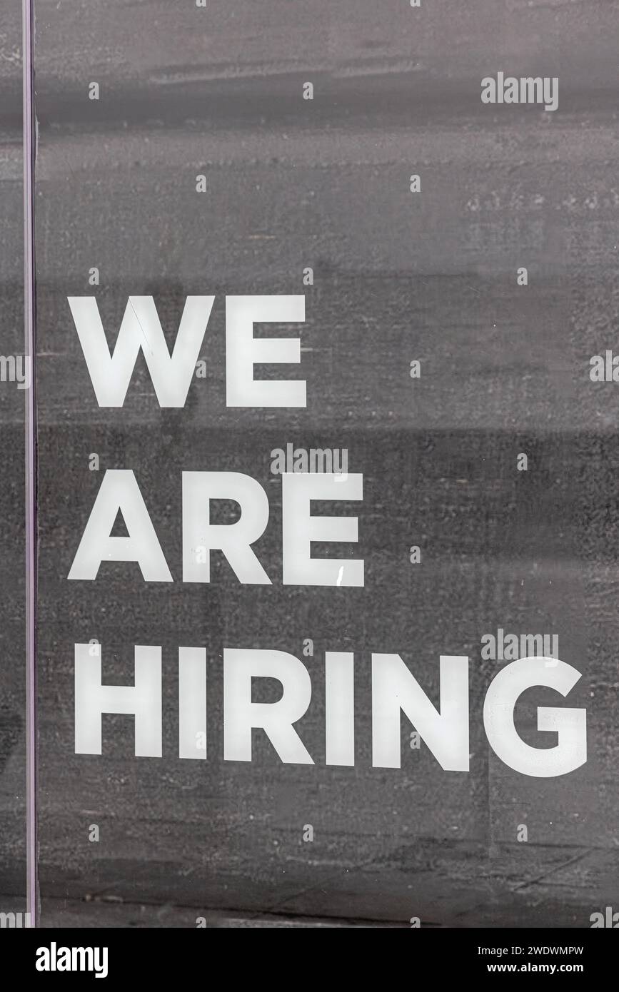 Sign We Are Hiring at Glass Shop Window Job Vacancy Stock Photo - Alamy