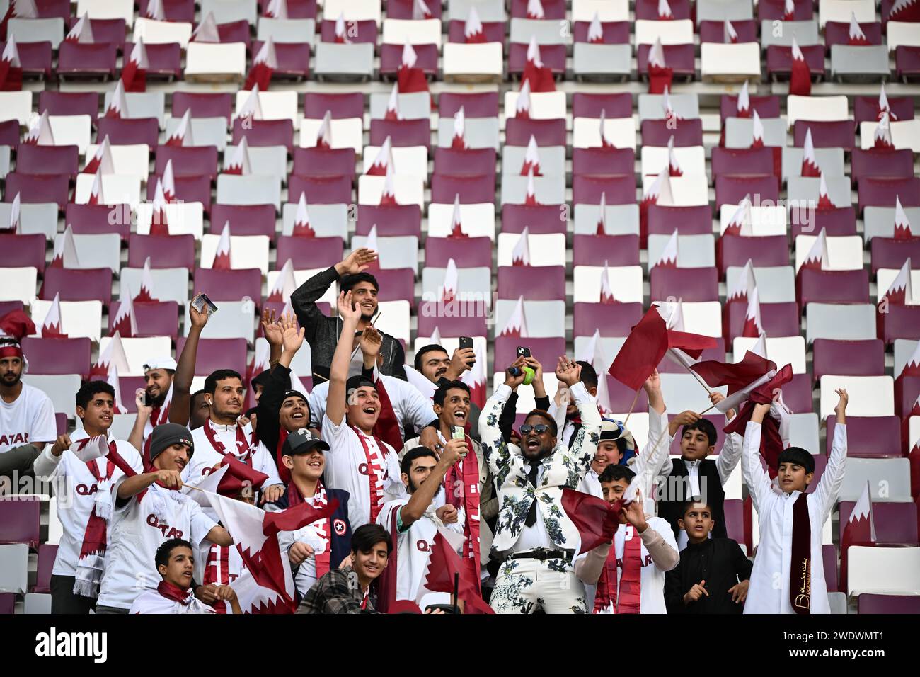 Doha, Qatar. 22nd Jan, 2024. Qatari fans cheer for the team prior to ...