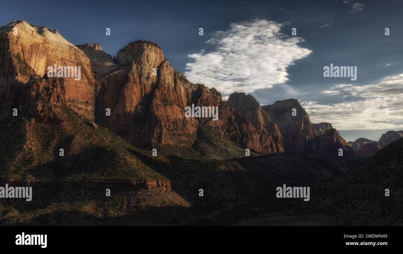 The mountain range and valley are in the shadows. Only mountain peaks ...