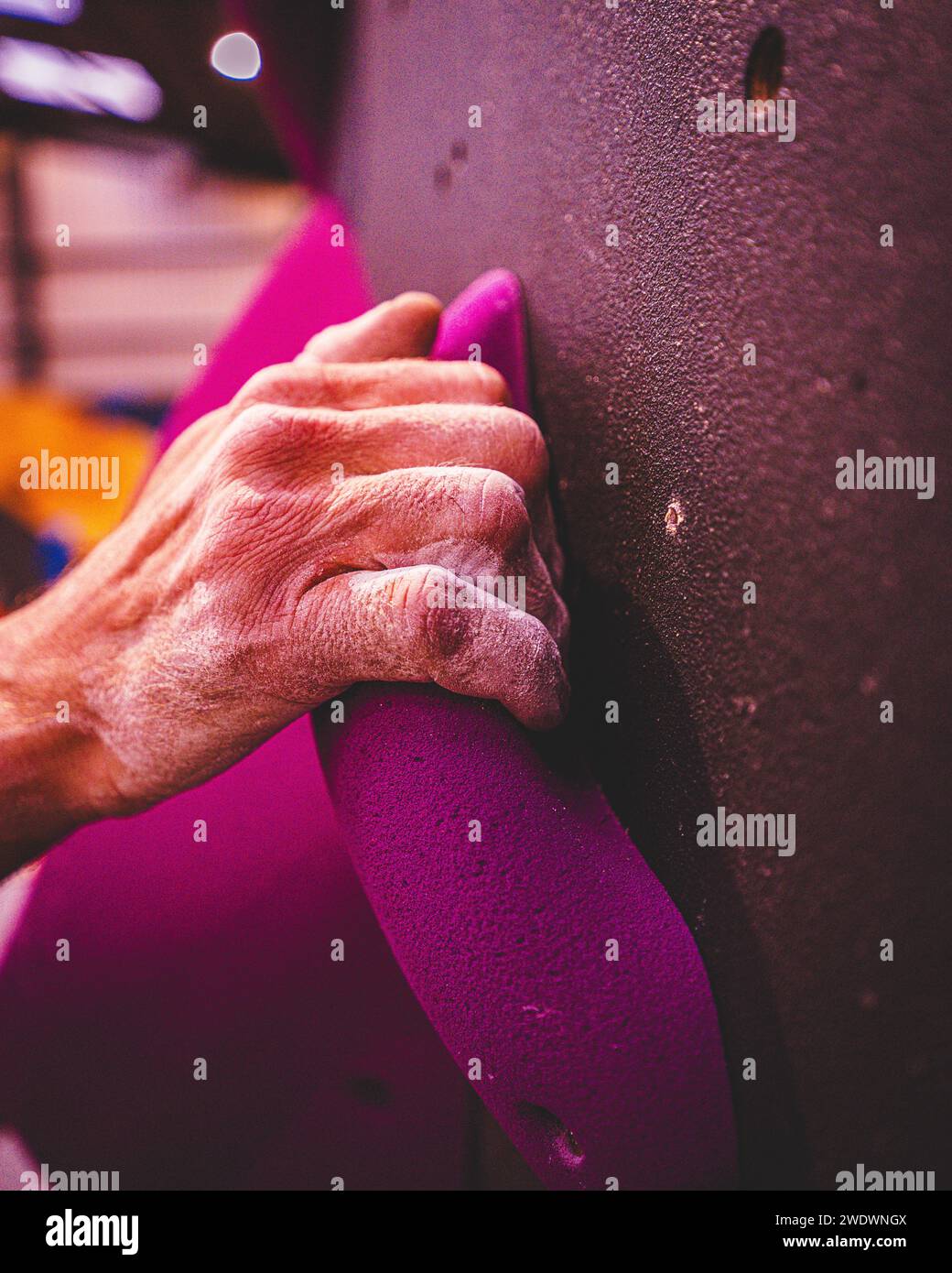 A Chalky hand on a climbing hold on an indoor climbing wall Stock Photo ...