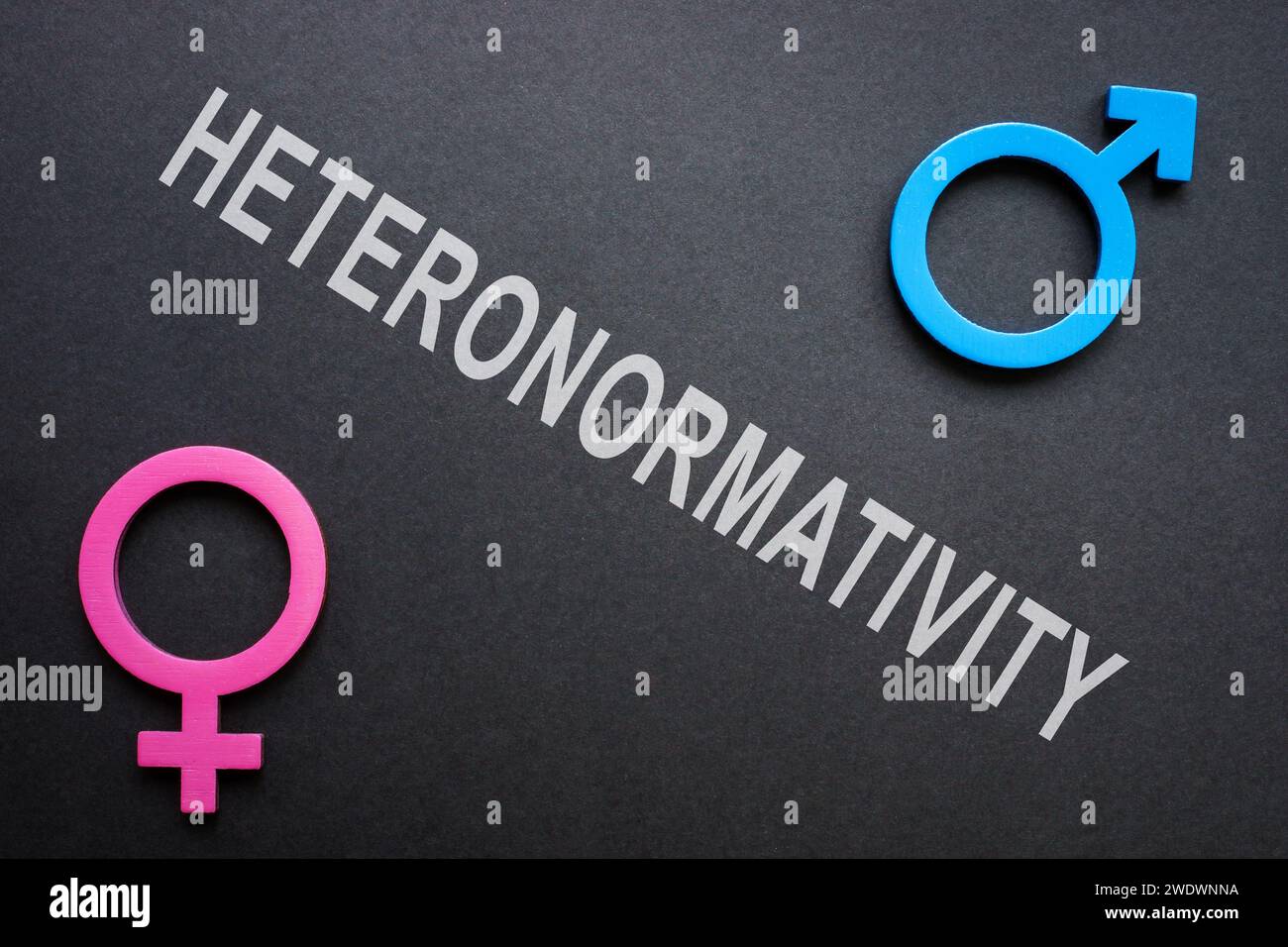 Male and female signs and inscription heteronormativity Stock Photo - Alamy