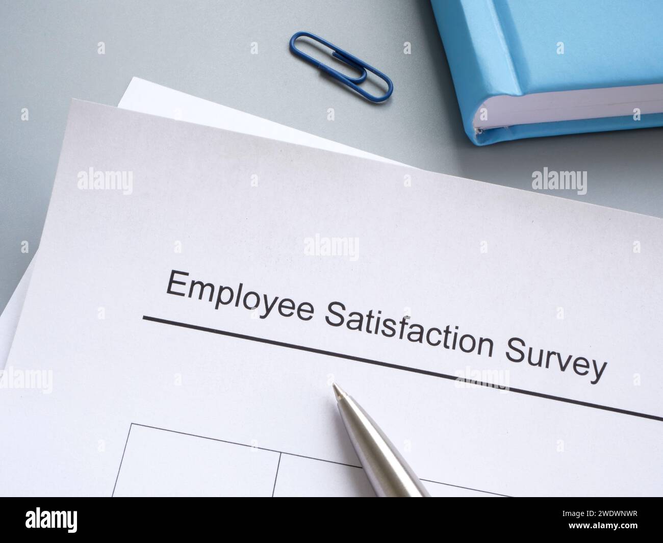 Employee satisfaction survey and pen on the table Stock Photo - Alamy