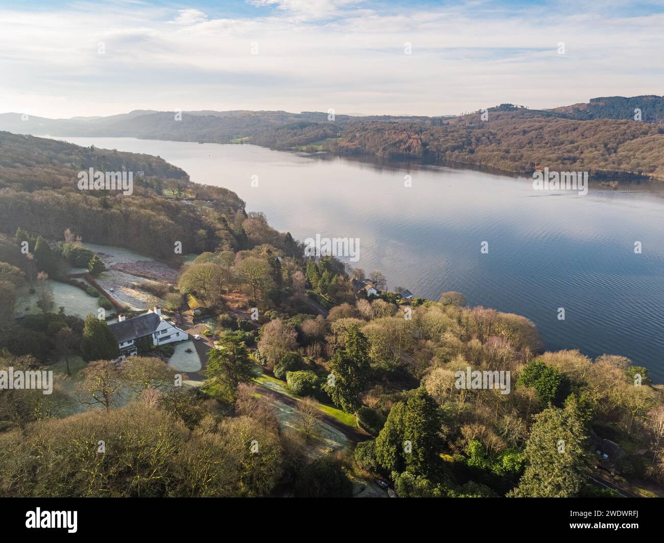 Aerial photograph of tree linLake Windermere, Cumbria, UK with the Lake ...