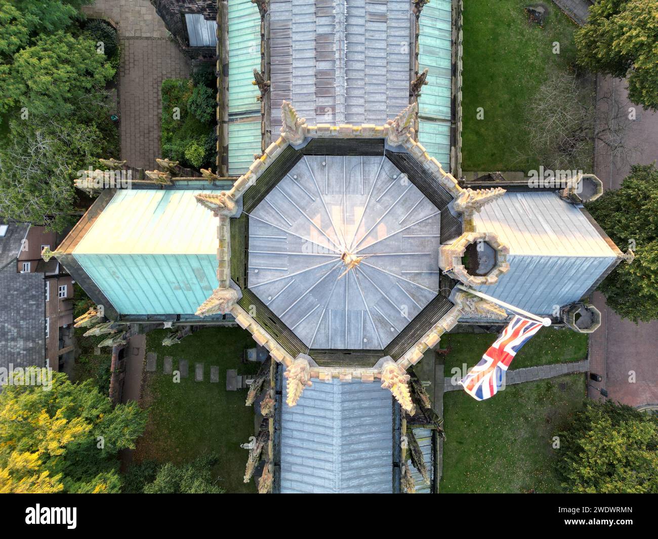 An Aerial view of a grand building featuring clock faces and the iconic ...