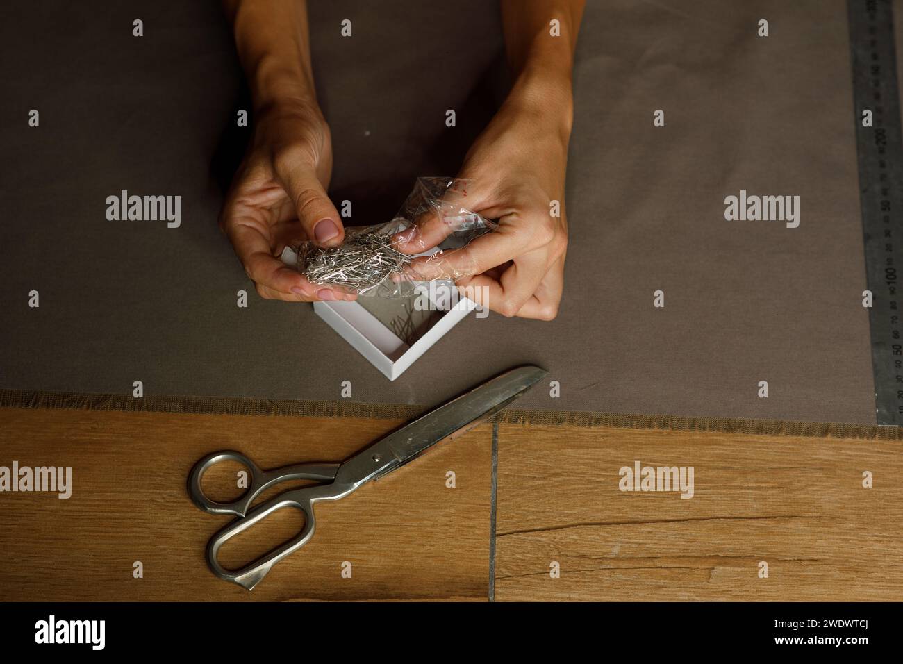 fabric marking hands ruler seamstress woman Stock Photo - Alamy